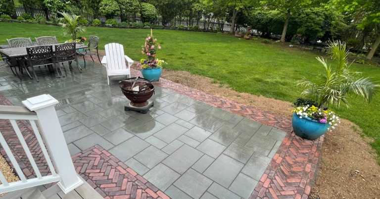 How does water exit your paver patio to prevent damage?